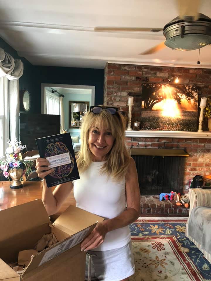 lori with book – REVELATIONS IN EDUCATION